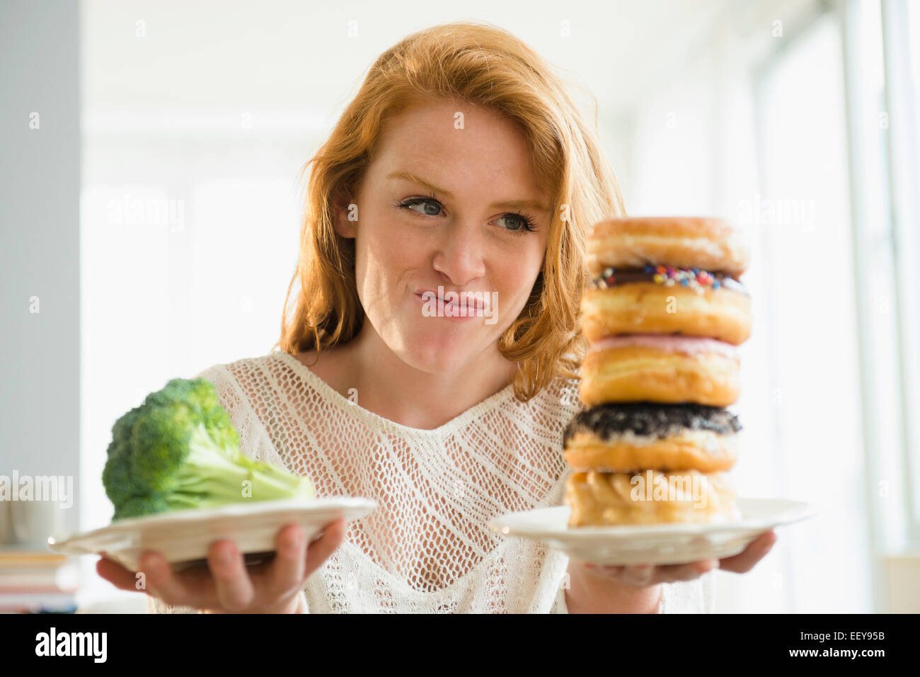 Young Woman Tempted Junk Food High Resolution Stock Photography and ...
