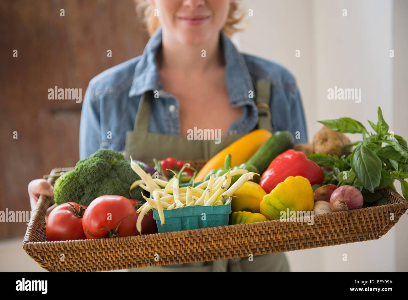 Young woman holding tray with vegetables Stock Photo - Alamy Young woman holding tray with vegetables Stock Photo - Alamy