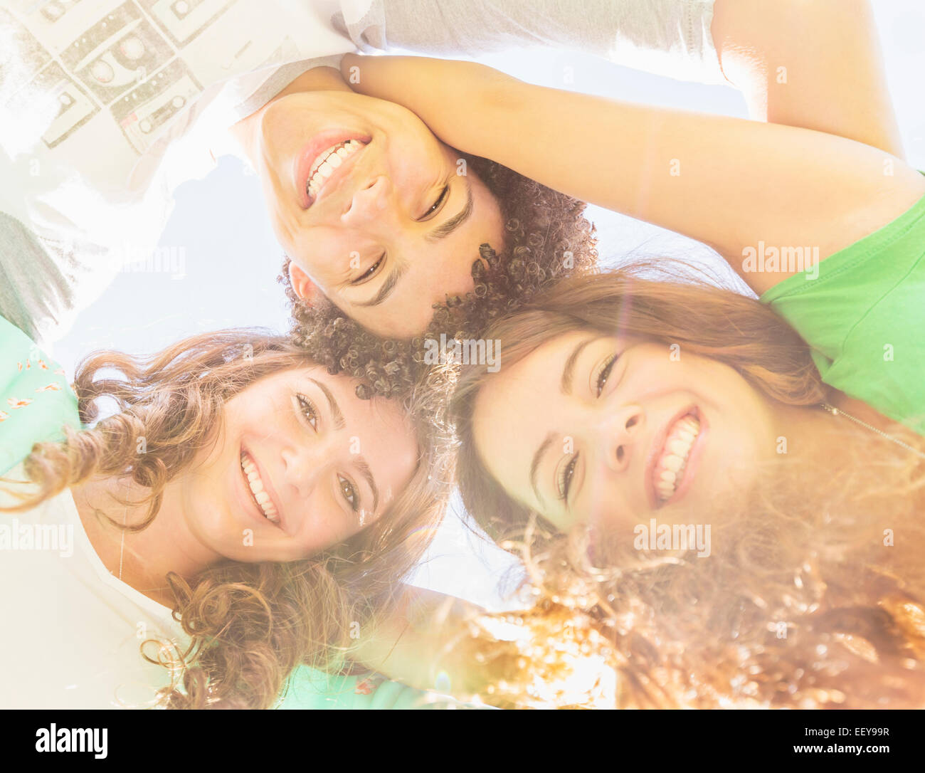 Portrait of friends (14-15) looking down Stock Photo - Alamy