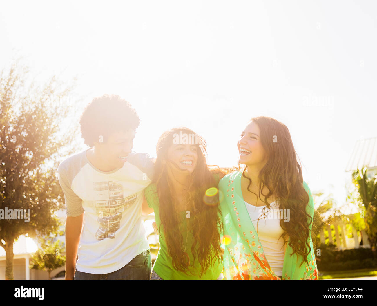 Three girls friends walk together hi-res stock photography and images ...