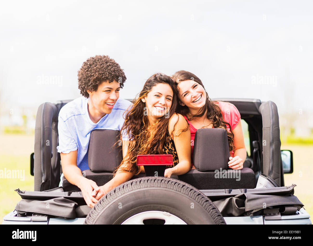 Portrait of friend (14-15) during road trip Stock Photo - Alamy