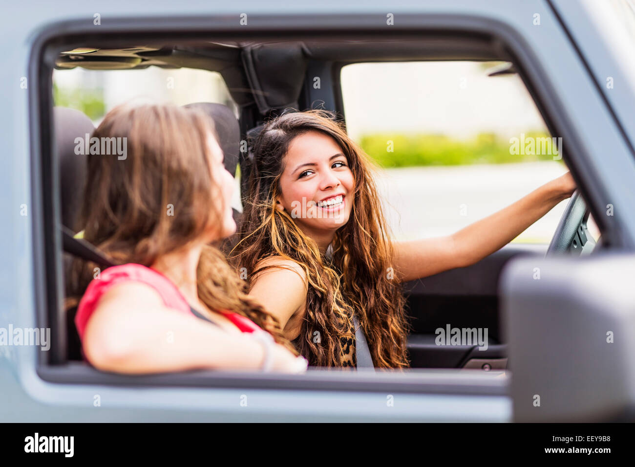 Female friends (14-15) during road trip Stock Photo - Alamy