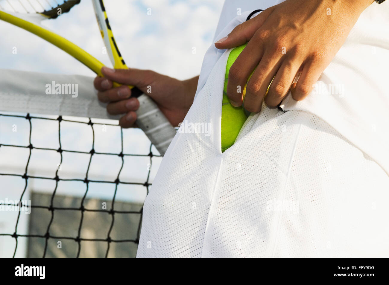 Tennis player alone on a court Stock Photo - Alamy