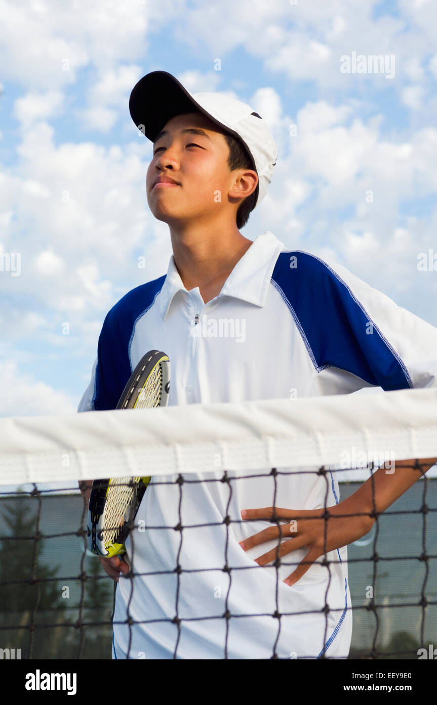 Tennis player alone on a court Stock Photo - Alamy