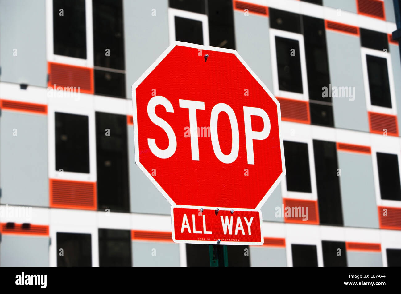 USA, New York State, New York City, Stop sign with building in ...