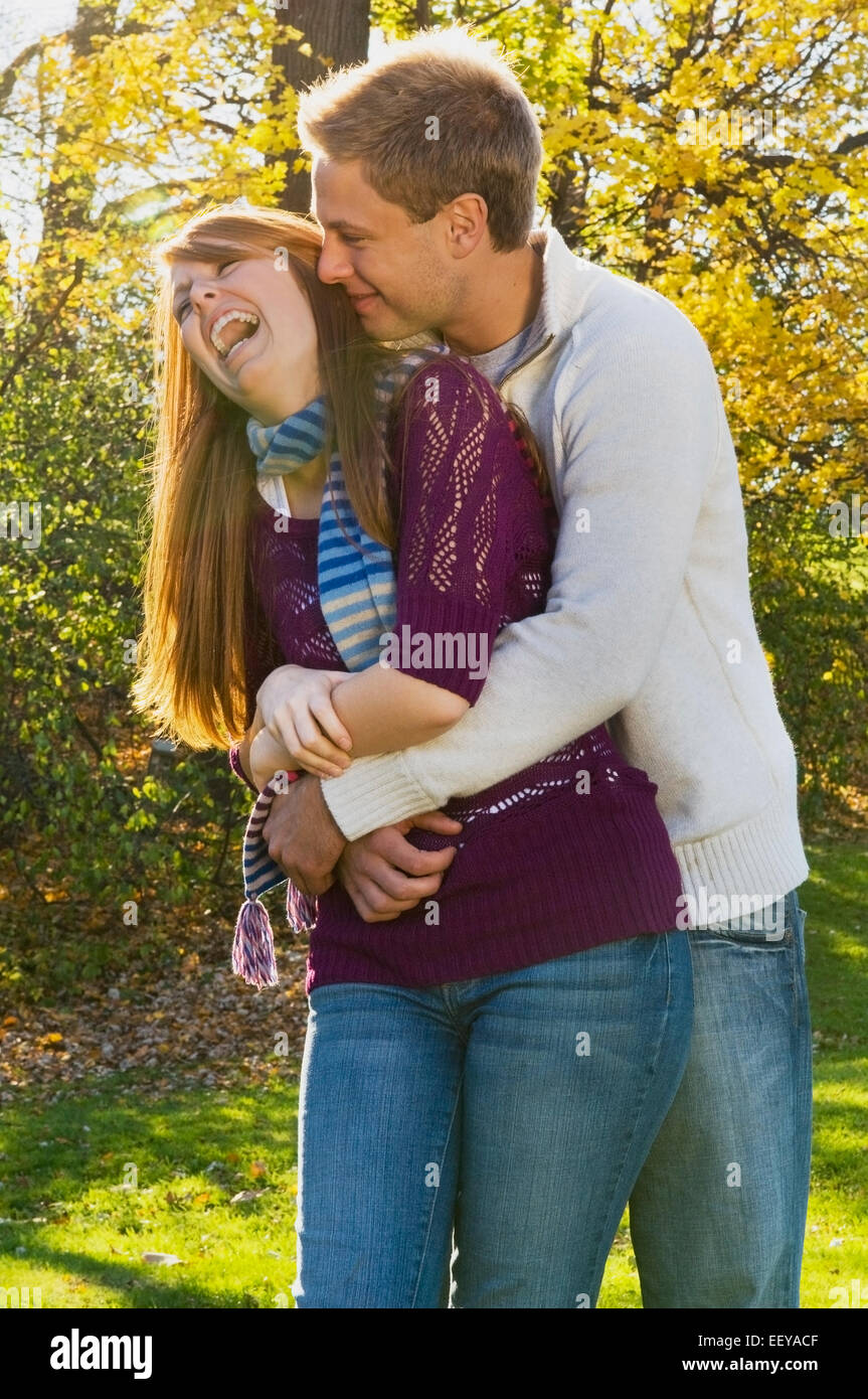 Couple being affectionate in a park Stock Photo - Alamy