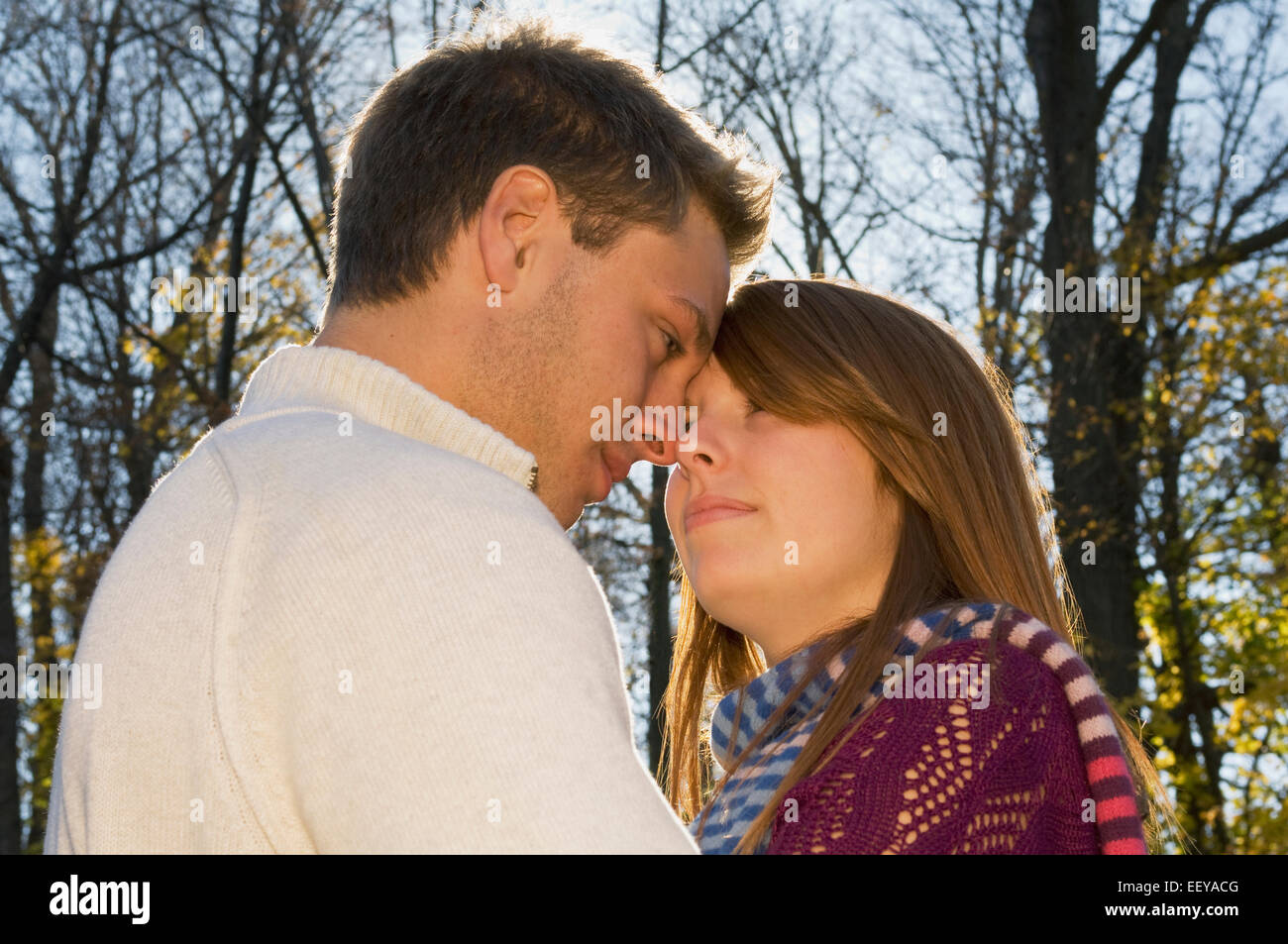 Couple being affectionate in a park Stock Photo - Alamy