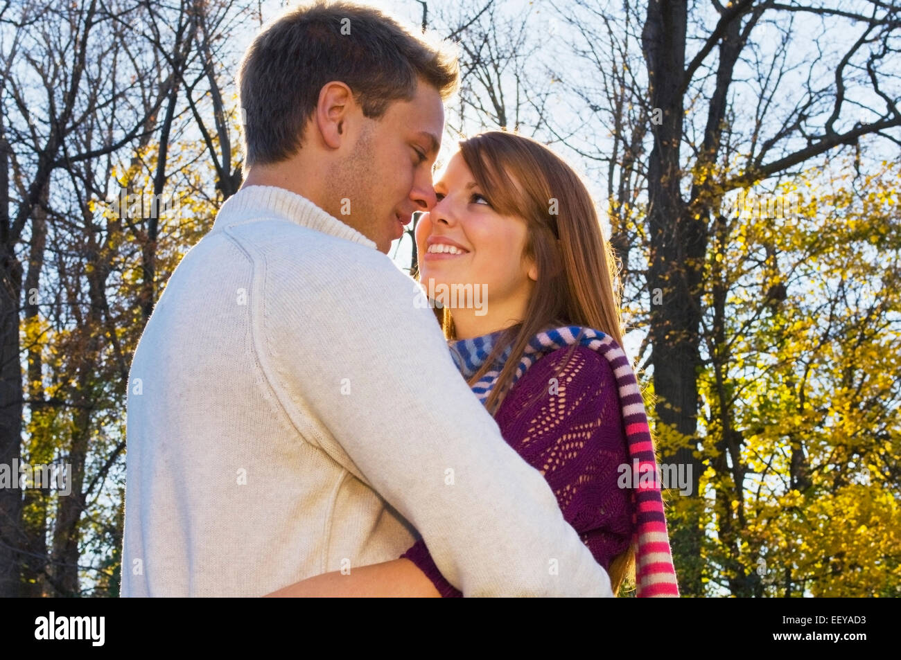 Couple being affectionate in a park Stock Photo - Alamy