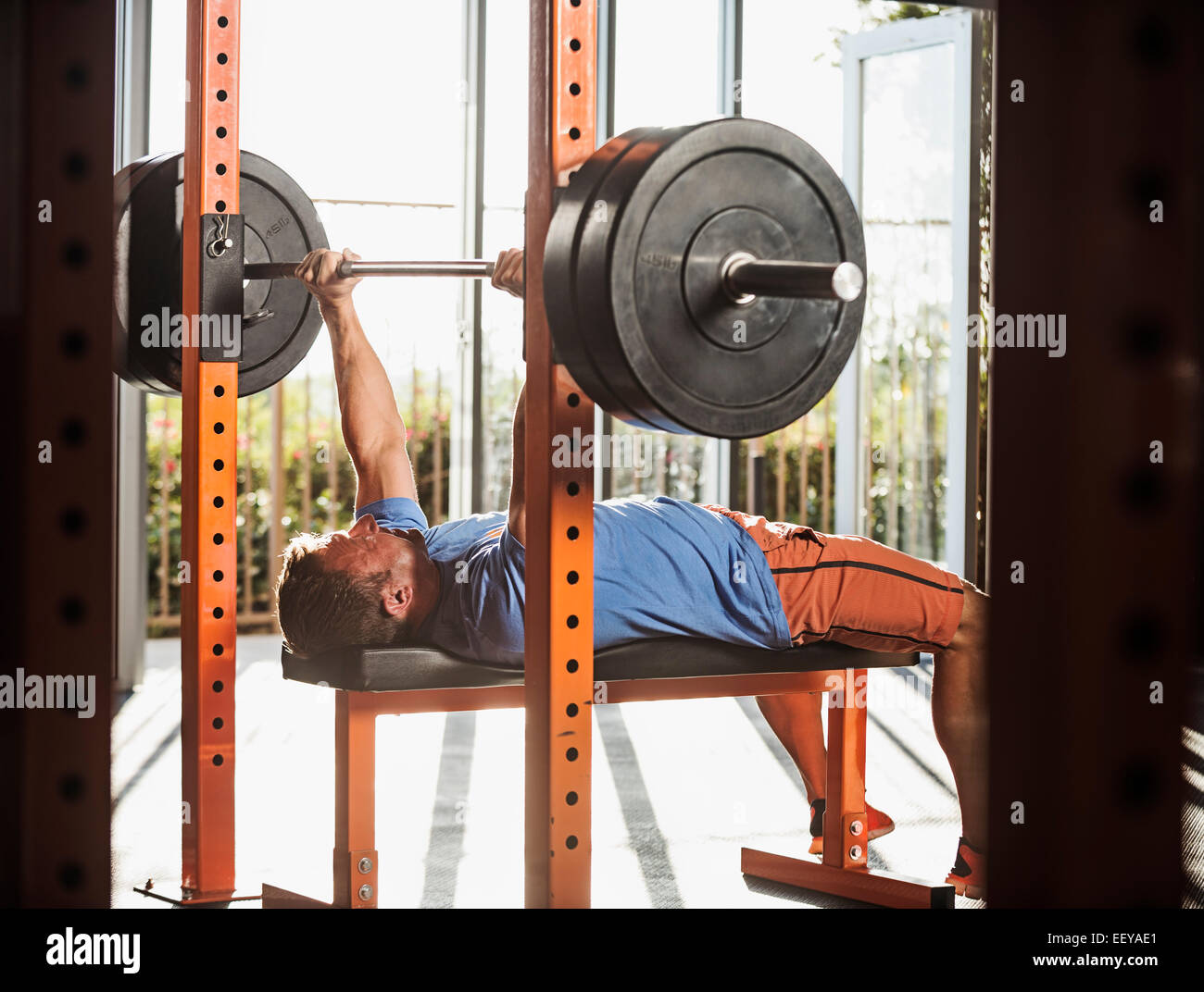 Mature man bench pressing Stock Photo - Alamy