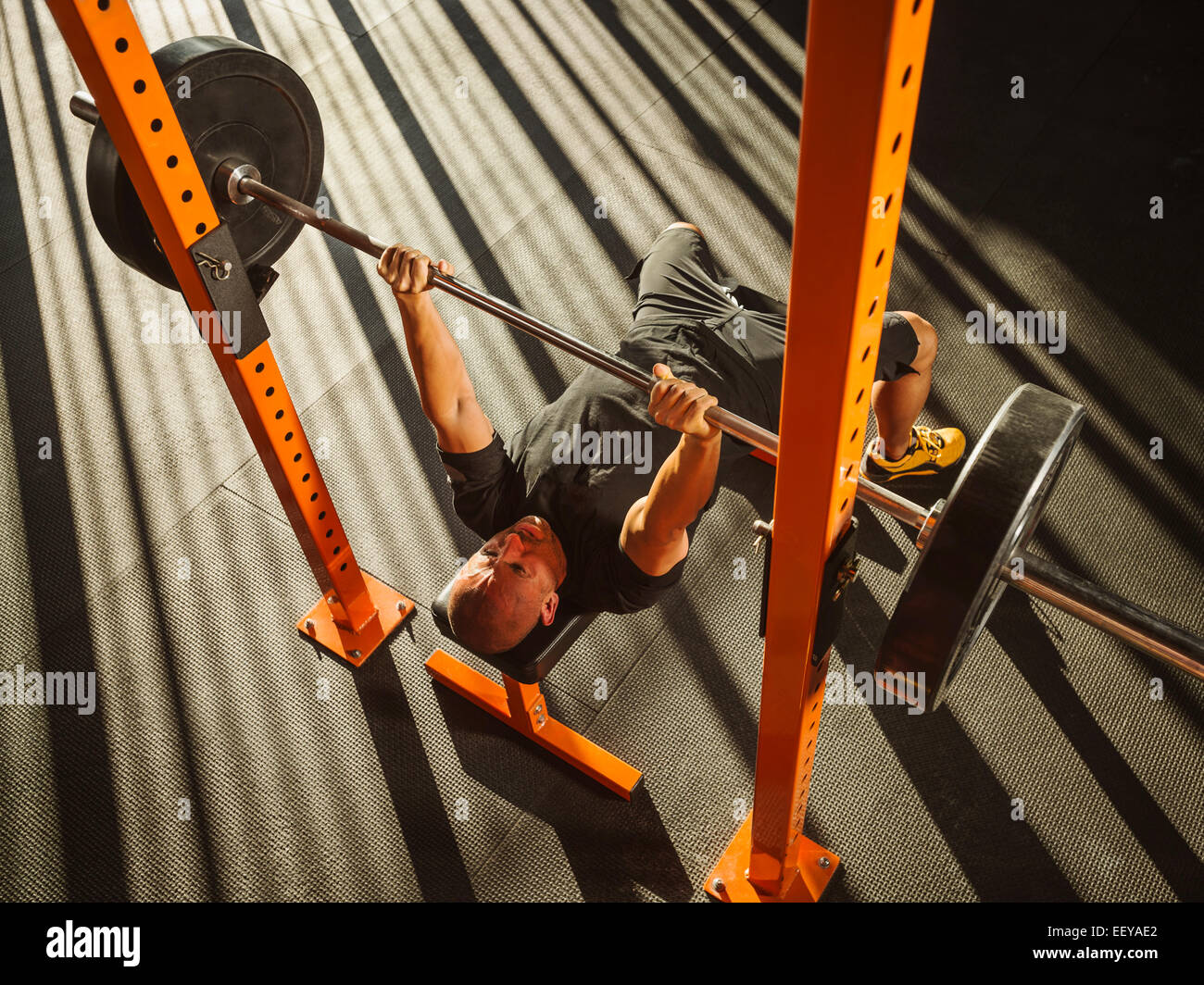Mature man bench pressing Stock Photo - Alamy