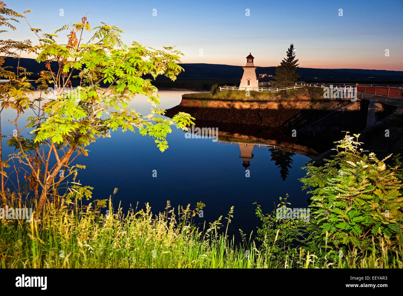 Canada, New Brunswick, Anderson Hollow Lighthouse by pond at dusk Stock ...