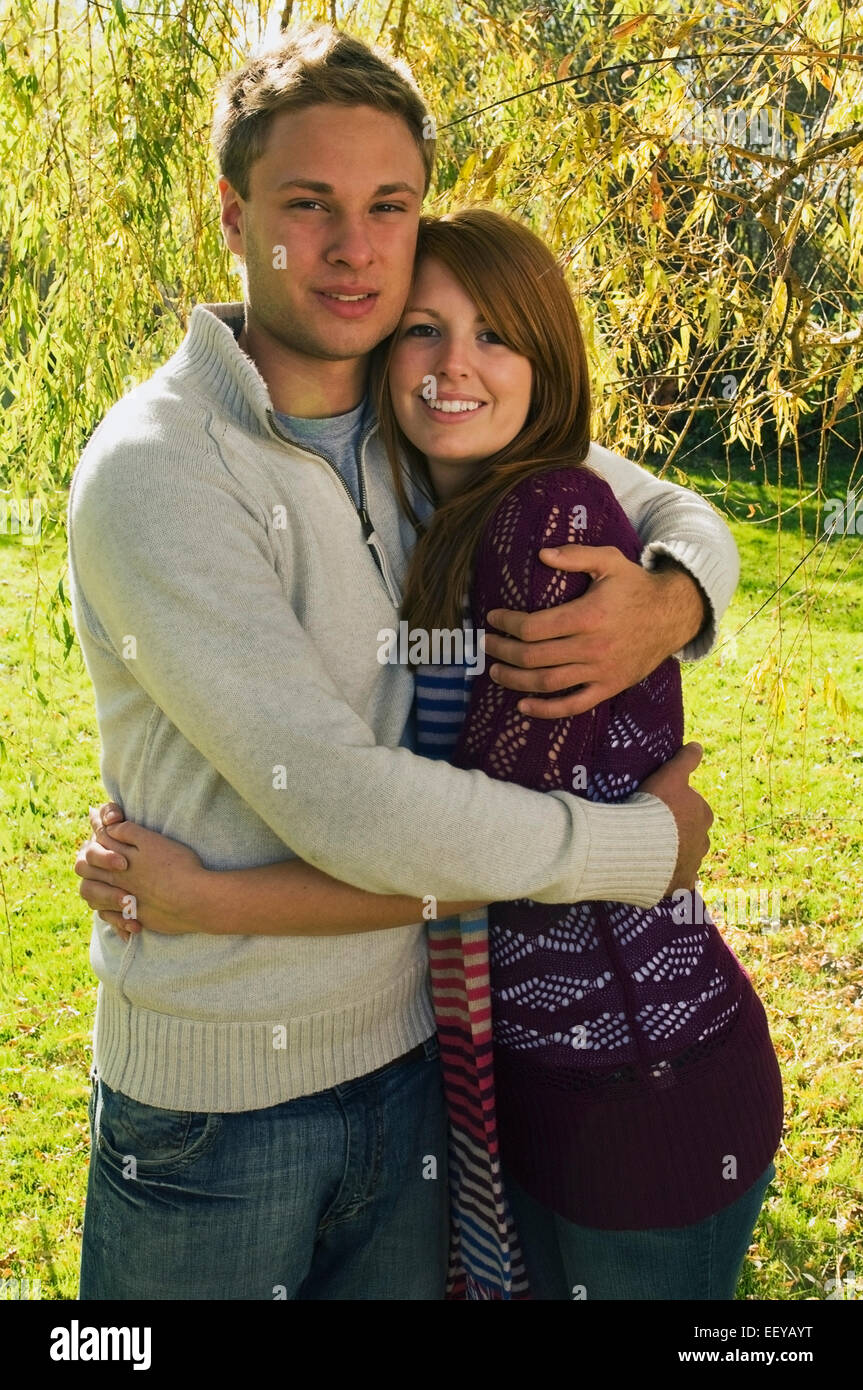 Couple being affectionate in a park Stock Photo - Alamy