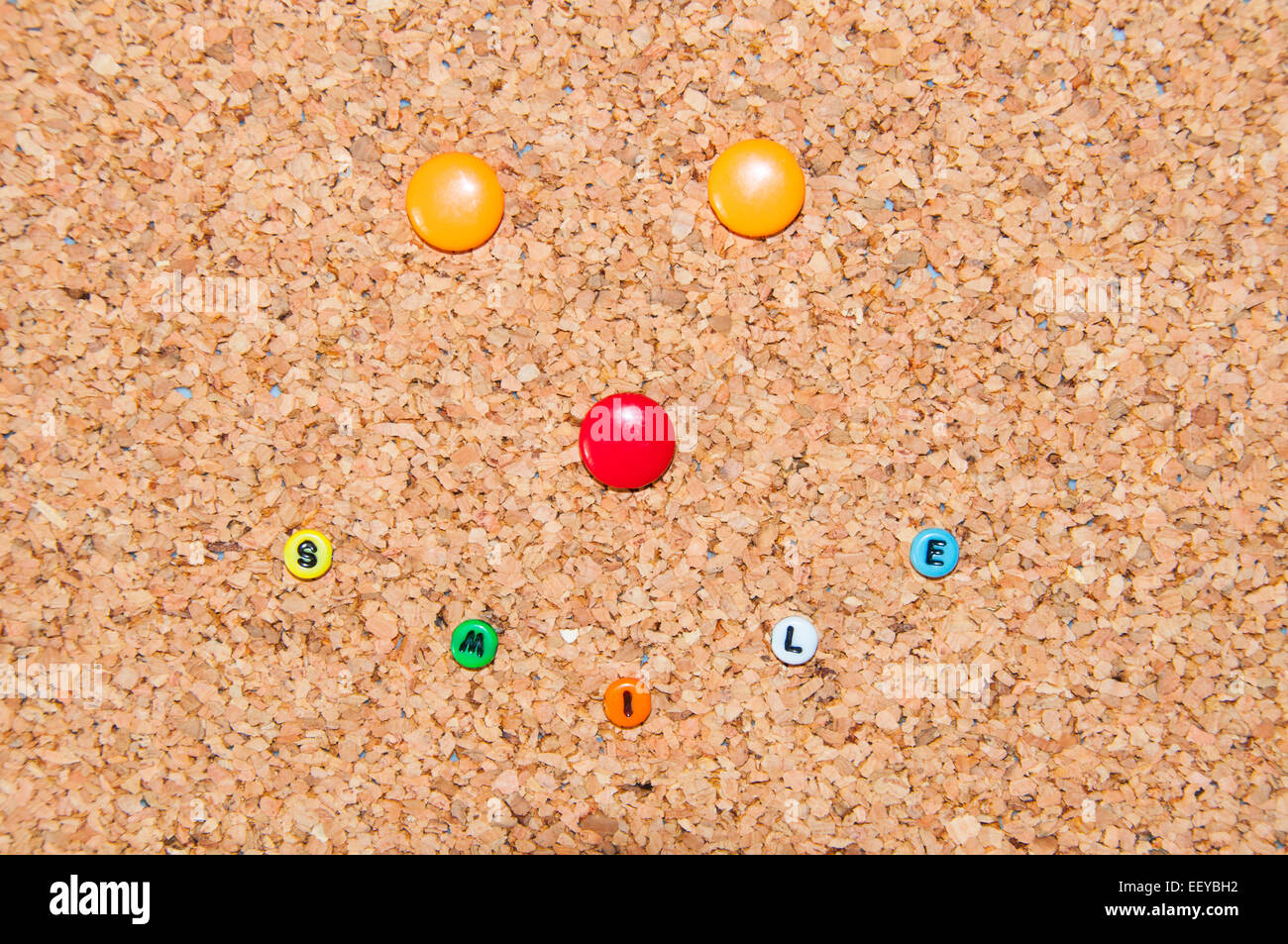 Colored smile face on cork Stock Photo - Alamy