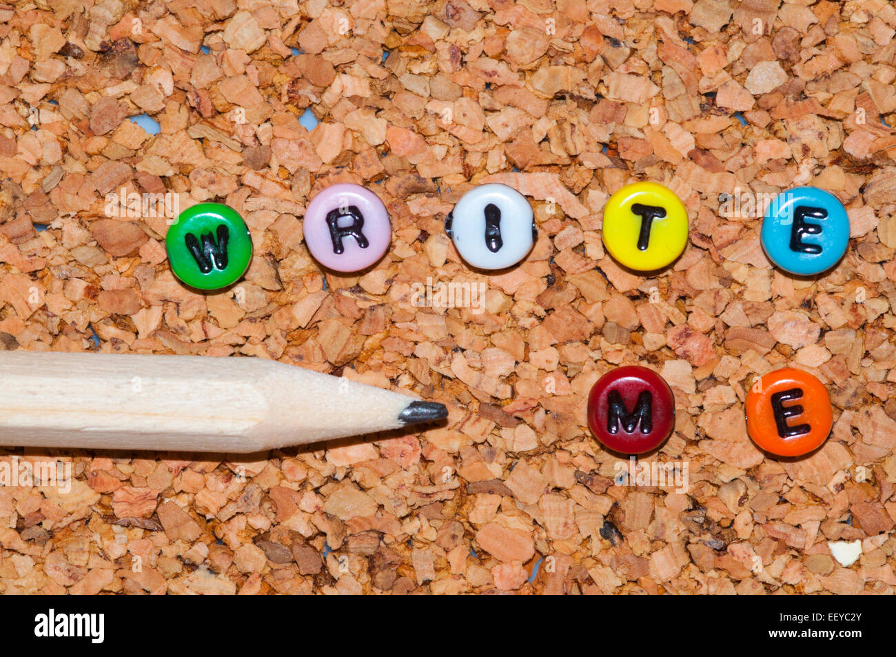 Colored write me with pencil on cork background Stock Photo - Alamy