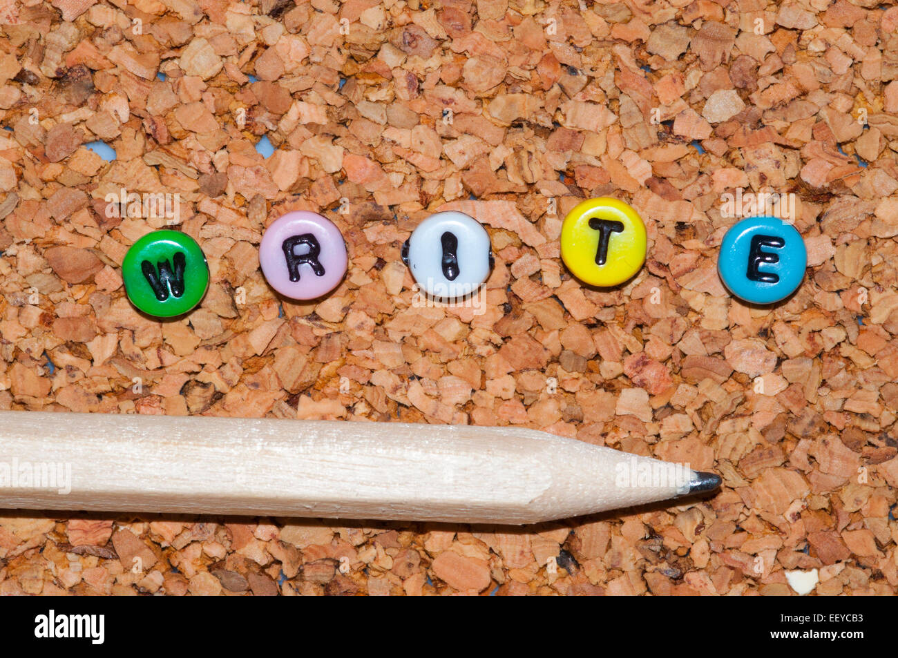 Colored write with pencil on cork background Stock Photo - Alamy