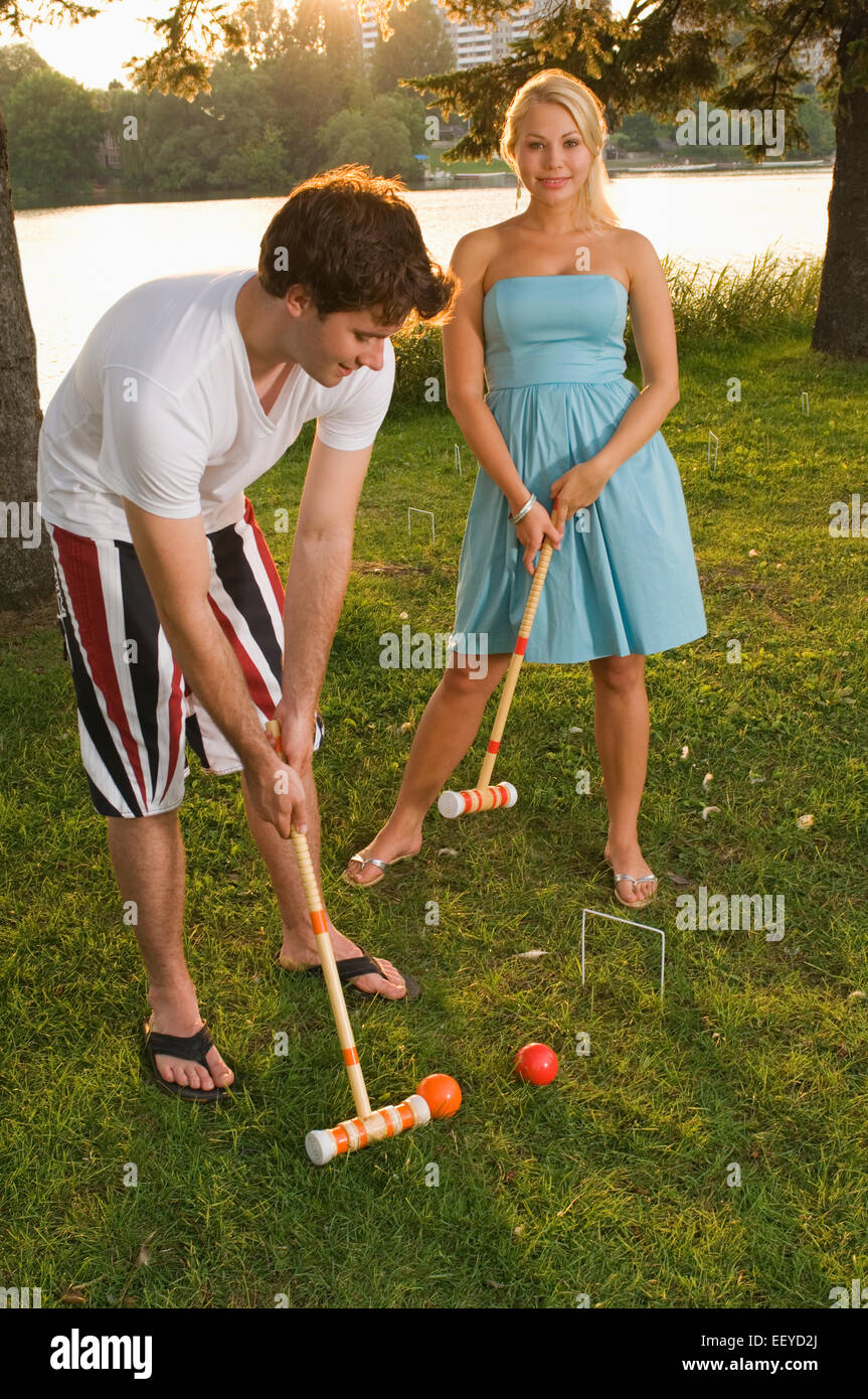 Couple playing croquet Stock Photo - Alamy