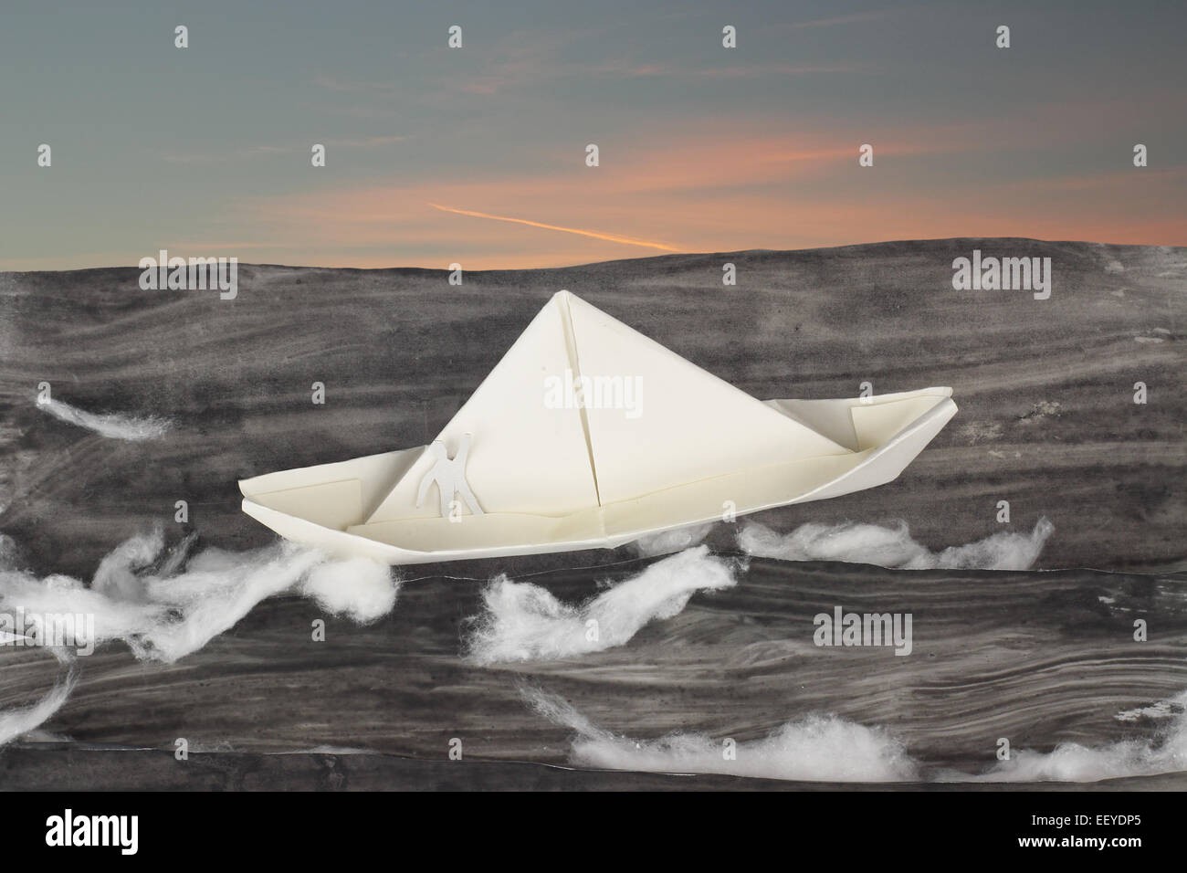 Paper boat sailing in the dangerous ocean Stock Photo - Alamy