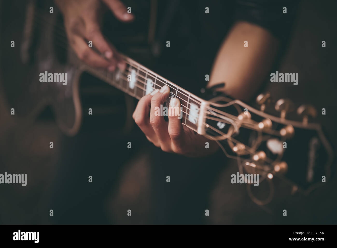 man playing on acoustic guitar no face Stock Photo - Alamy