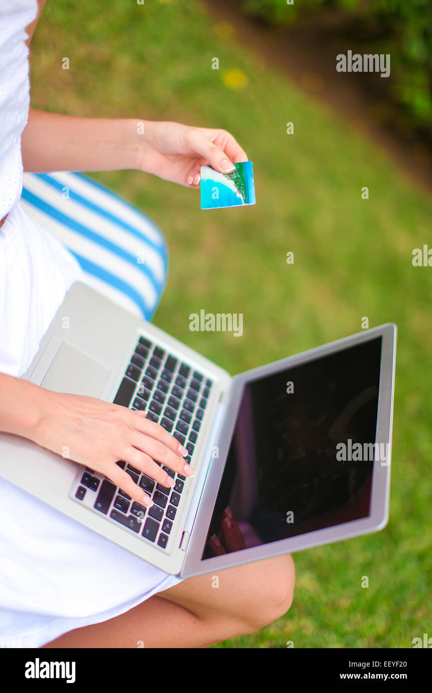 Young woman with laptop during summer vacation Stock Photo - Alamy
