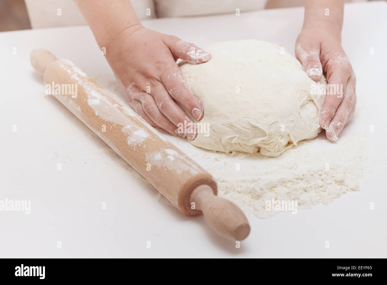 Woman Hands Kneading Dough on the table Stock Photo - Alamy