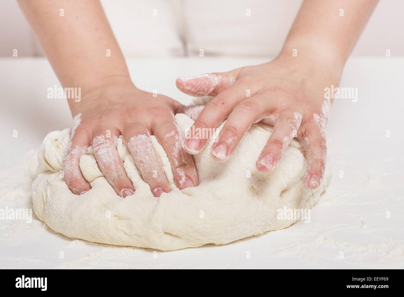Woman Hands Kneading Dough on the table Stock Photo - Alamy