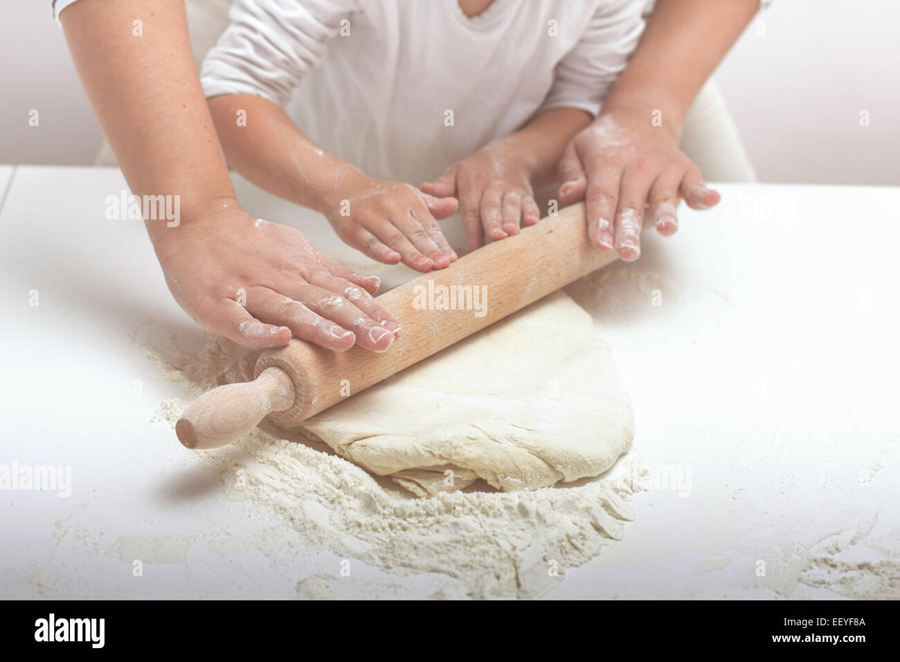 Mother and Daughter Hands Kneading Dough on the table Stock Photo - Alamy