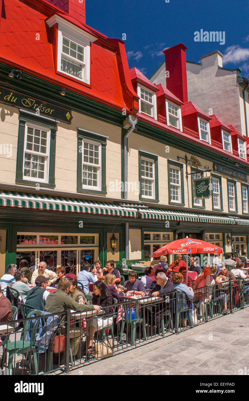 QUEBEC CITY, QUEBEC, CANADA - People eat and drink at outdoor tables in ...