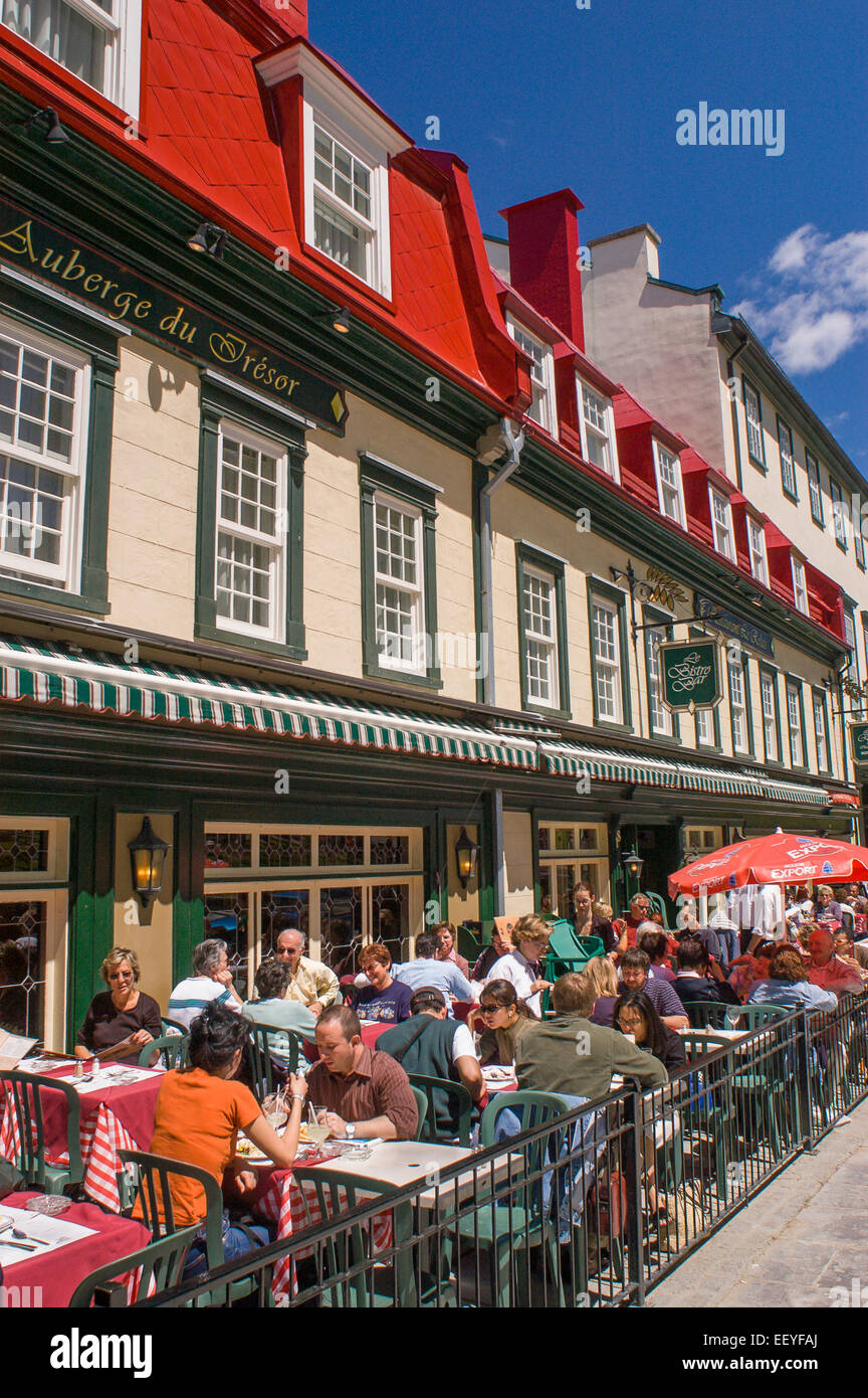 QUEBEC CITY, QUEBEC, CANADA - People eat and drink at outdoor tables in ...