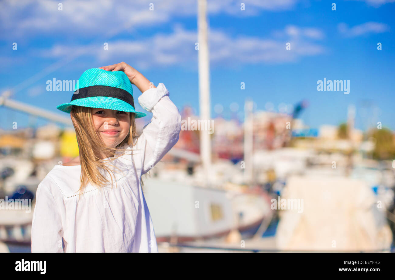 Cute little girl having fun in a port during summer vacation Stock ...