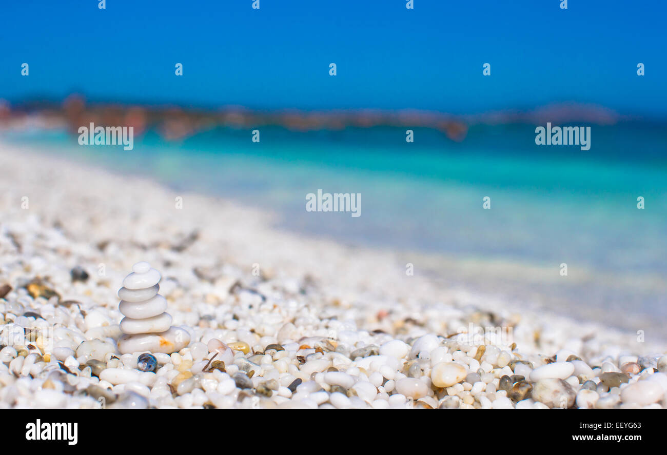 Stack of small white stones on tropical pebbles beach Stock Photo - Alamy