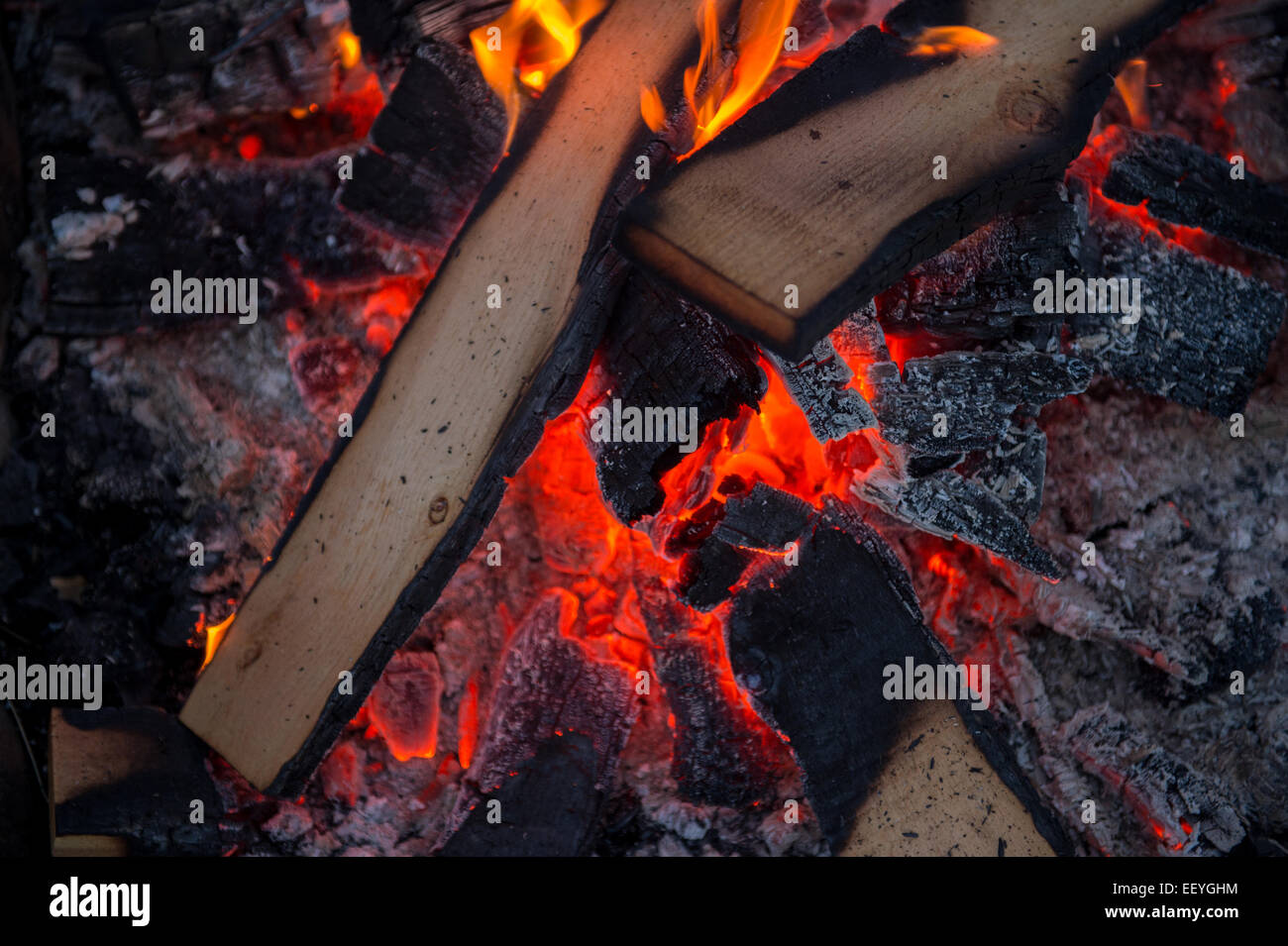 A campfire burns low at the Blacktail Ranch. Located at the base of the ...