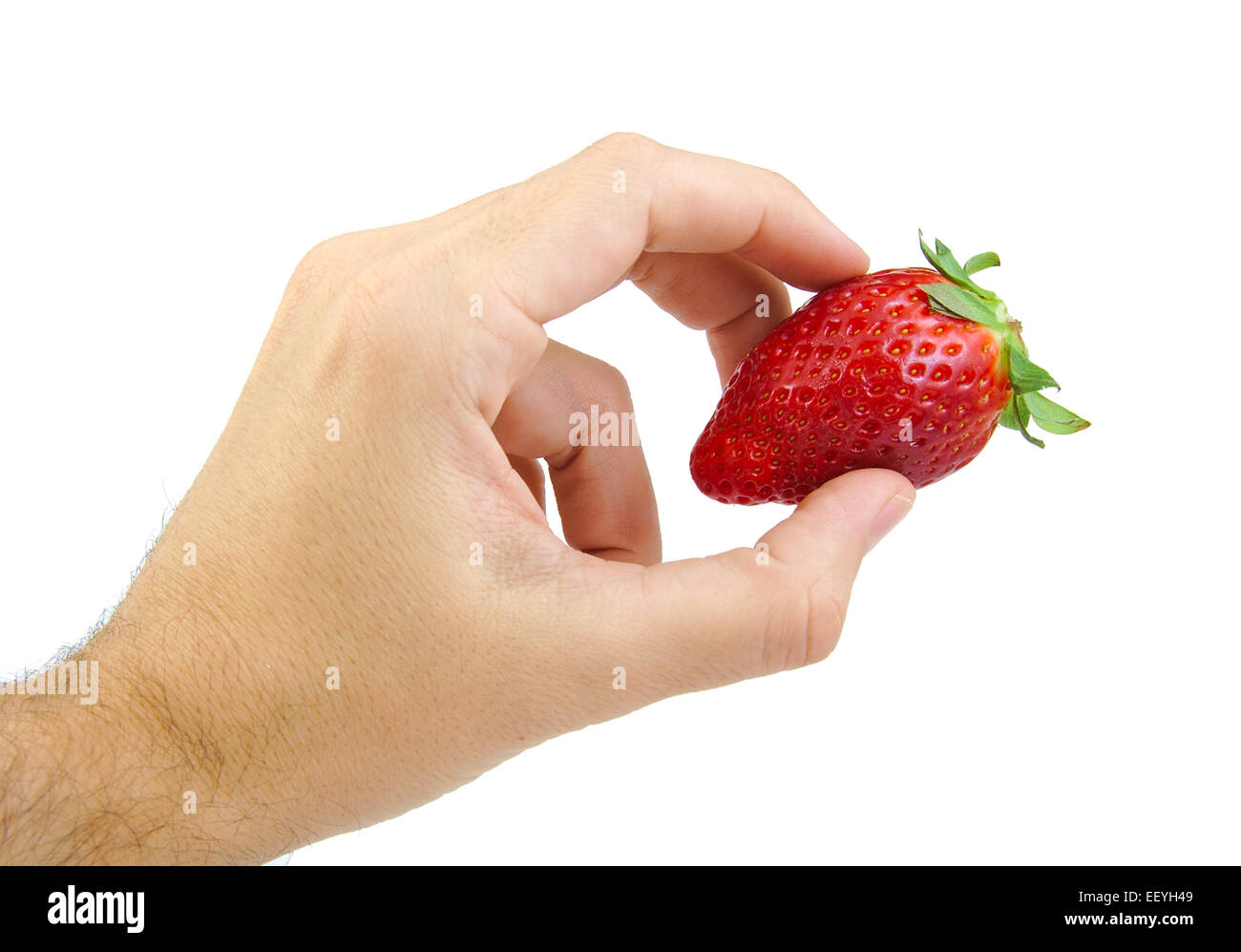 Hand holding a strawberry isolated on white Stock Photo - Alamy
