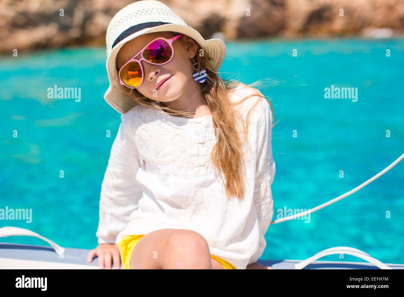 Little girl enjoying sailing on boat in the open sea Stock Photo - Alamy