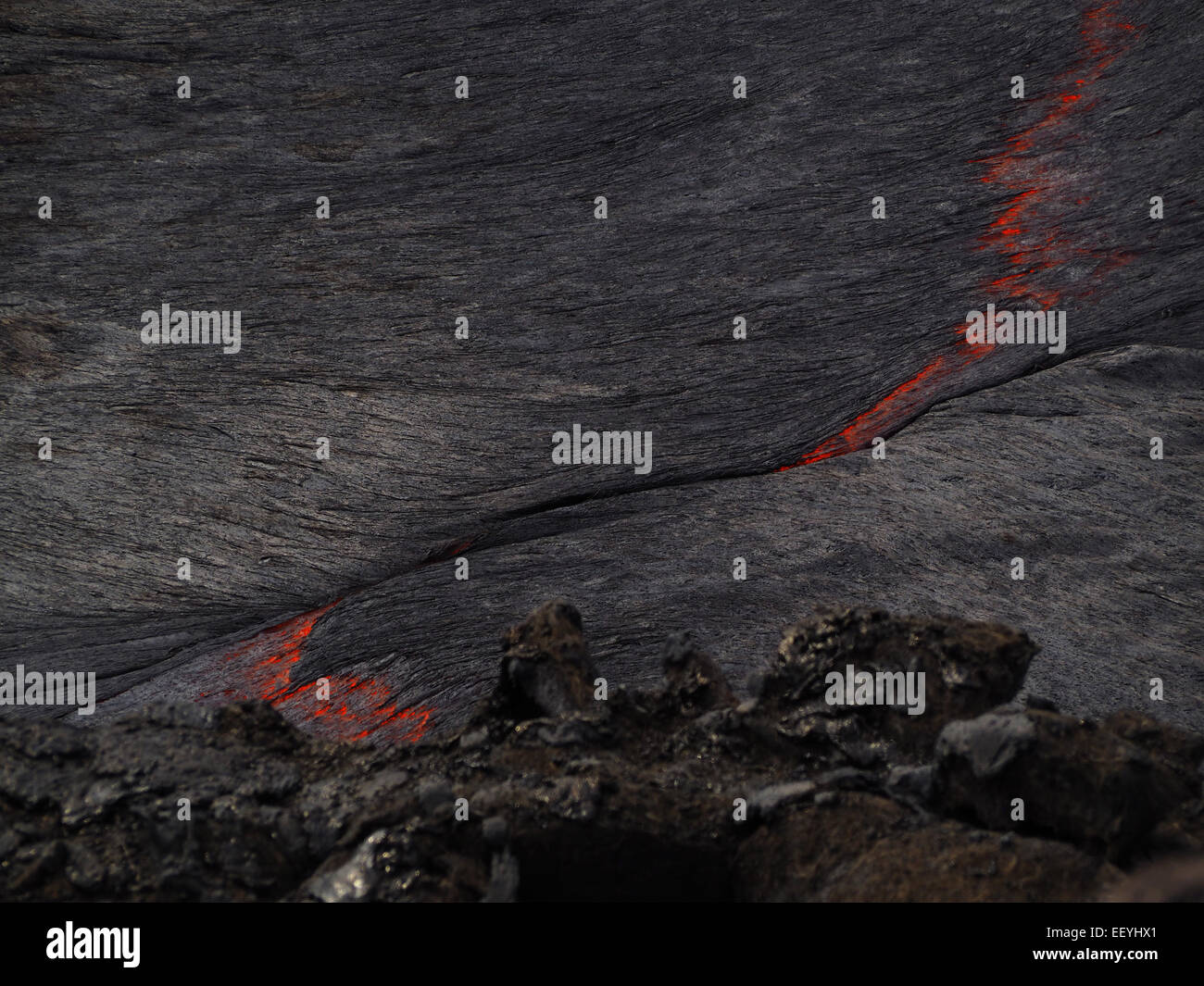 Lava burst inside the Erta Ale volcano. This lava lake is continuously ...