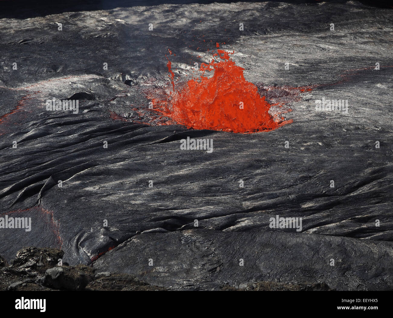 Lava burst inside the Erta Ale volcano. This lava lake is continuously ...