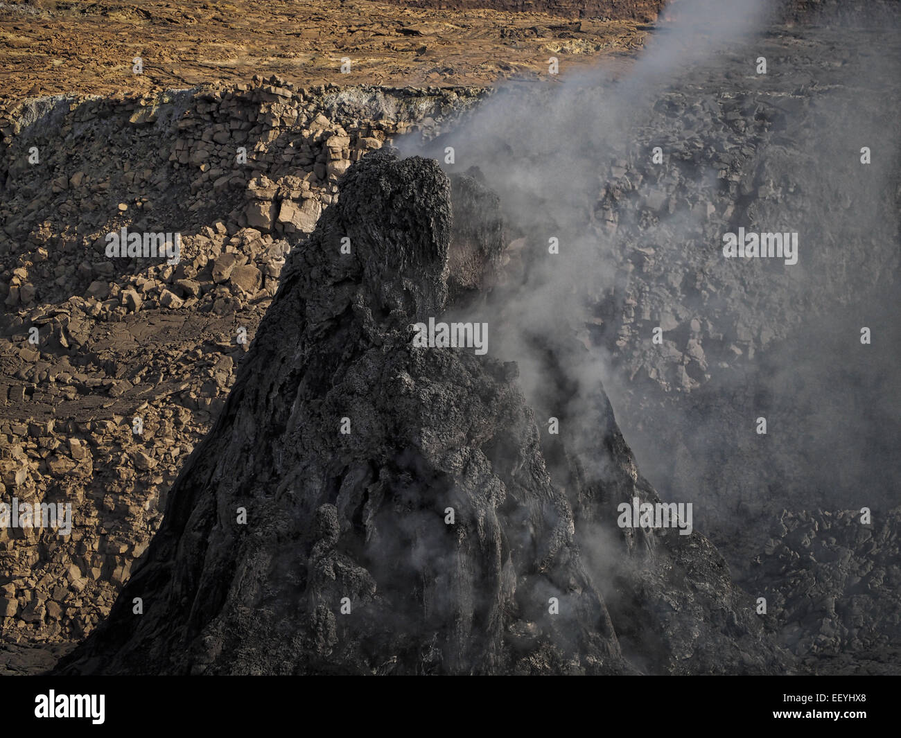 Smoking pinnacle in the Erta Ale volcano area. The lava flow formed ...