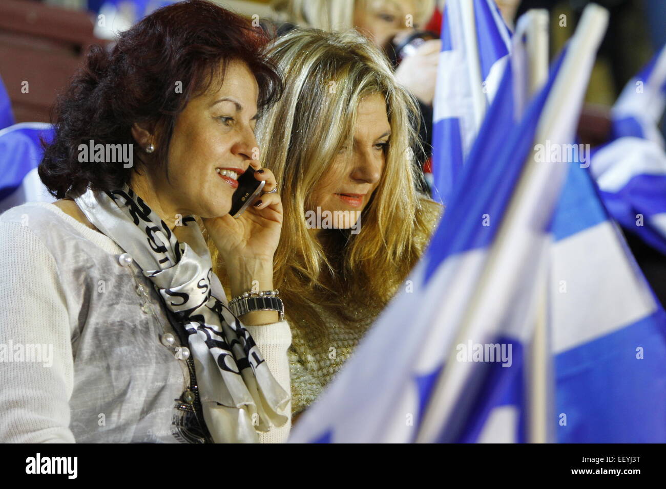 Two female supporters are pictured with a Greek flag. Néa Dimokratía ...