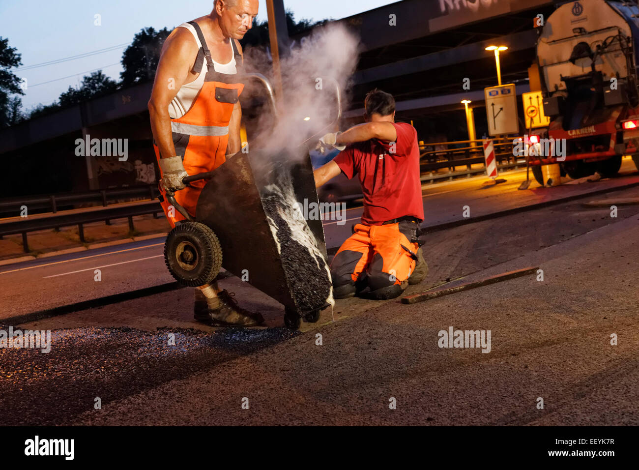 Highway construction site at night Stock Photo - Alamy