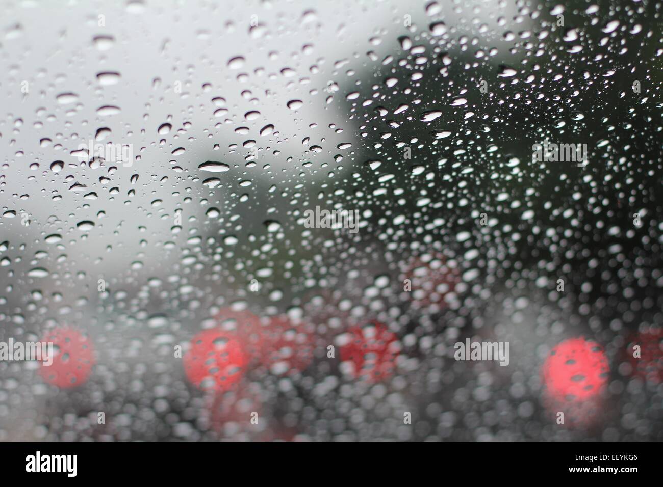 Raindrops on a window during winter Stock Photo - Alamy