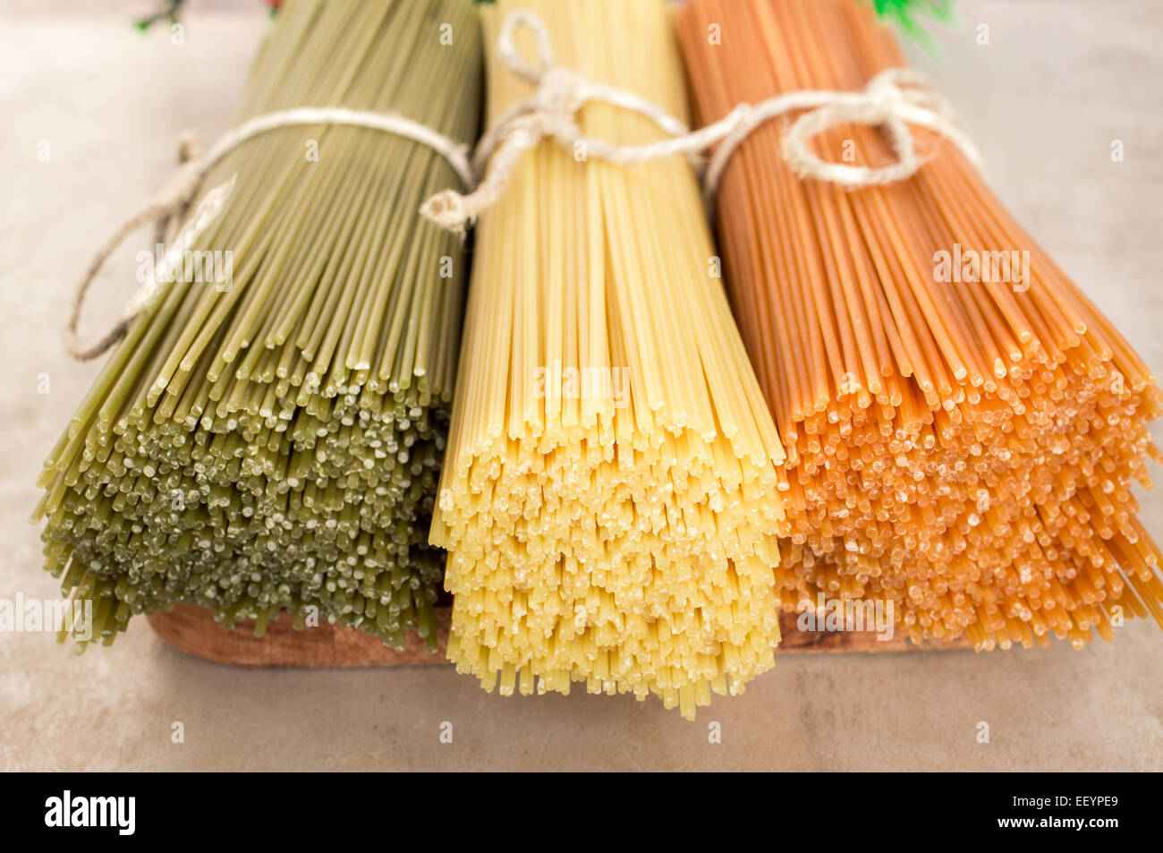 Spaghetti pasta in the colors of the Italian flag Stock Photo - Alamy
