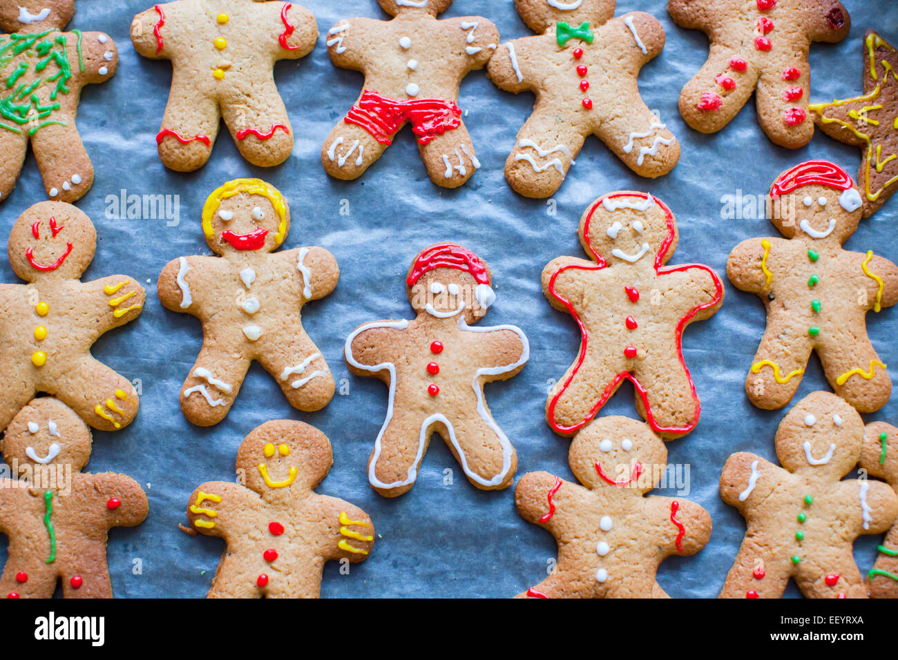 Cute gingerbread men on baking sheet for Christmas Stock Photo - Alamy