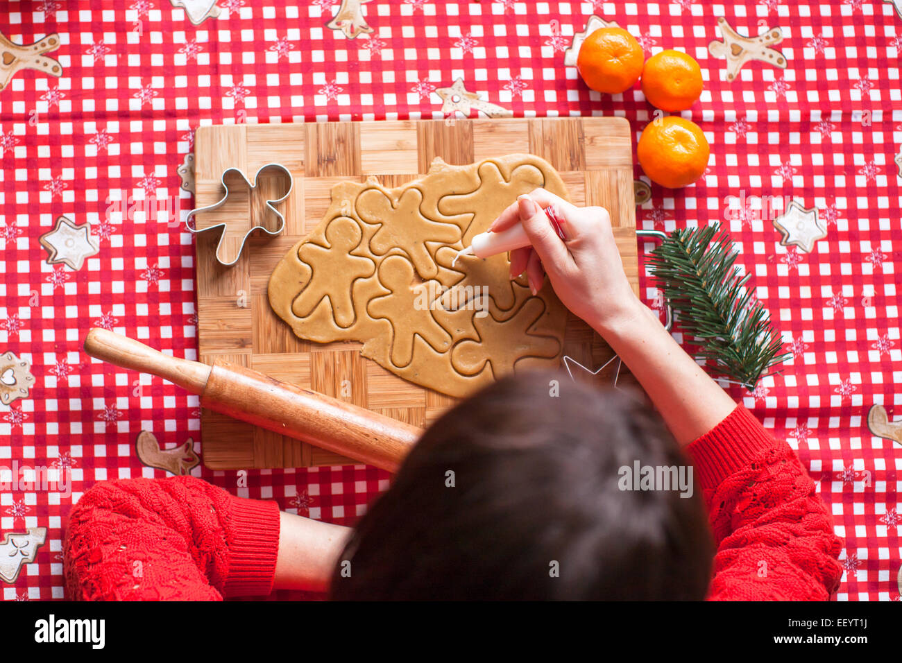 Hands making from dough Christmas gingerbread man Stock Photo - Alamy