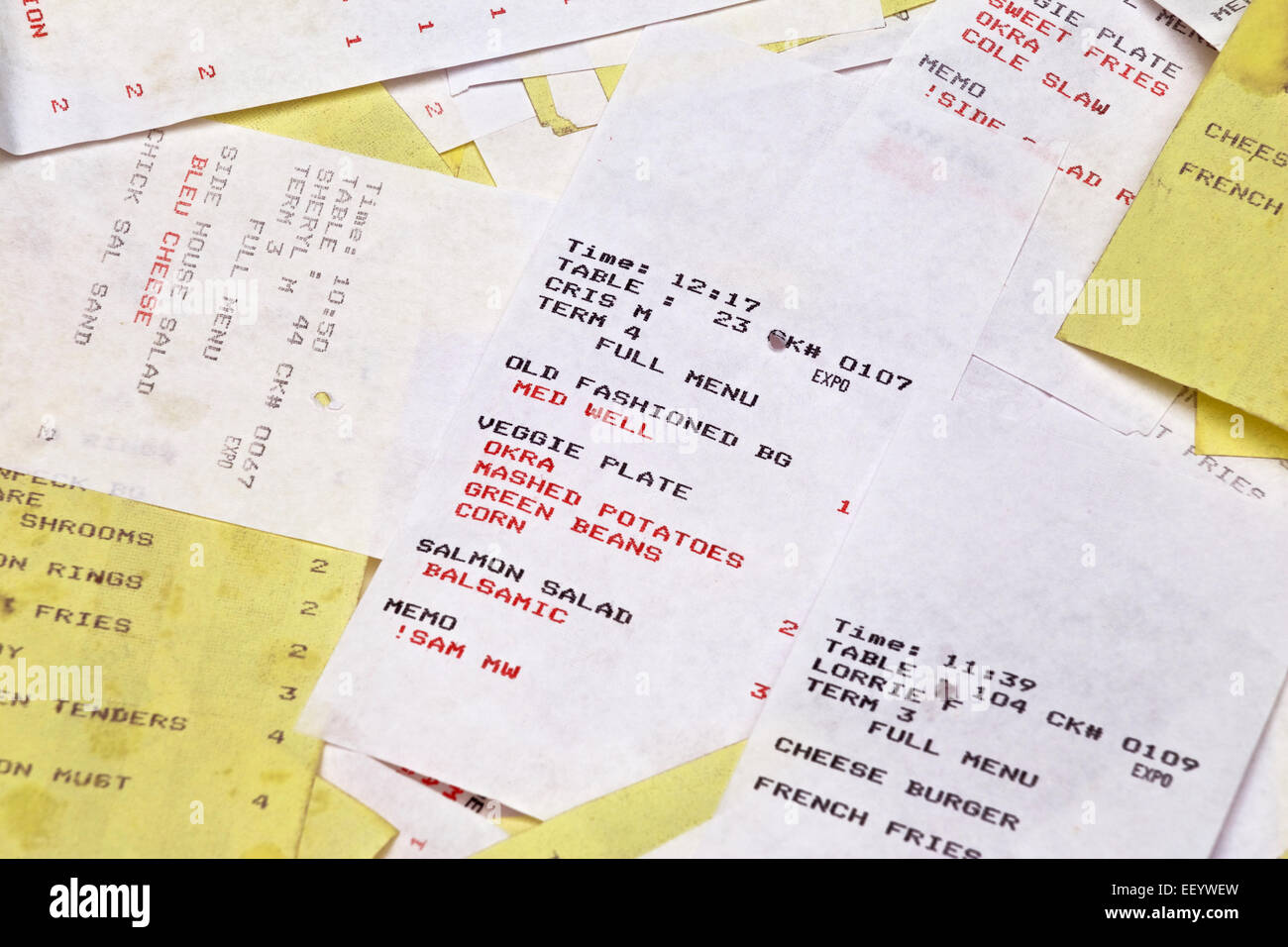 Grease stained restaurant food order tickets in a pile Stock Photo - Alamy