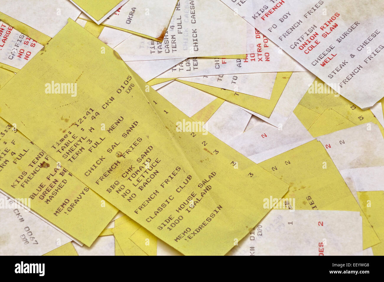 Greasy restaurant guest food order tickets in pile Stock Photo - Alamy