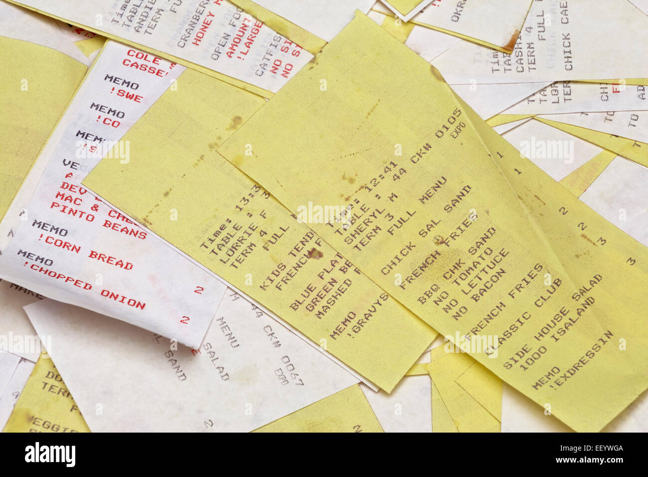 Greasy restaurant guest food order tickets in pile Stock Photo - Alamy