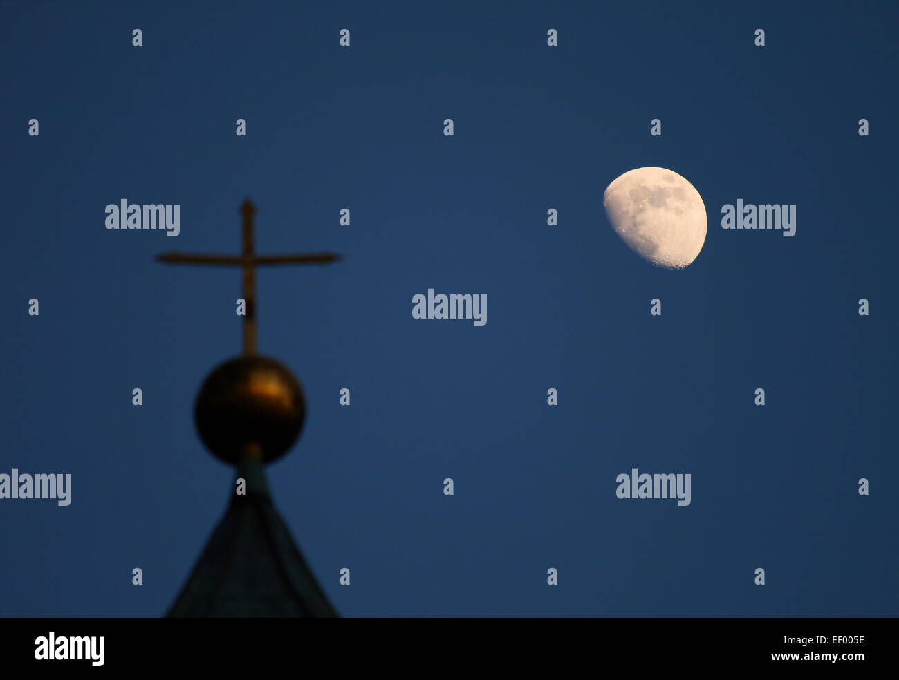 A church cross and the moon Stock Photo - Alamy