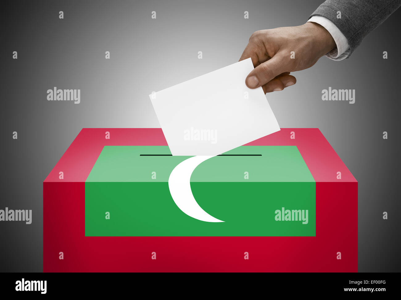 Ballot box painted into national flag colors - Maldives Stock Photo - Alamy
