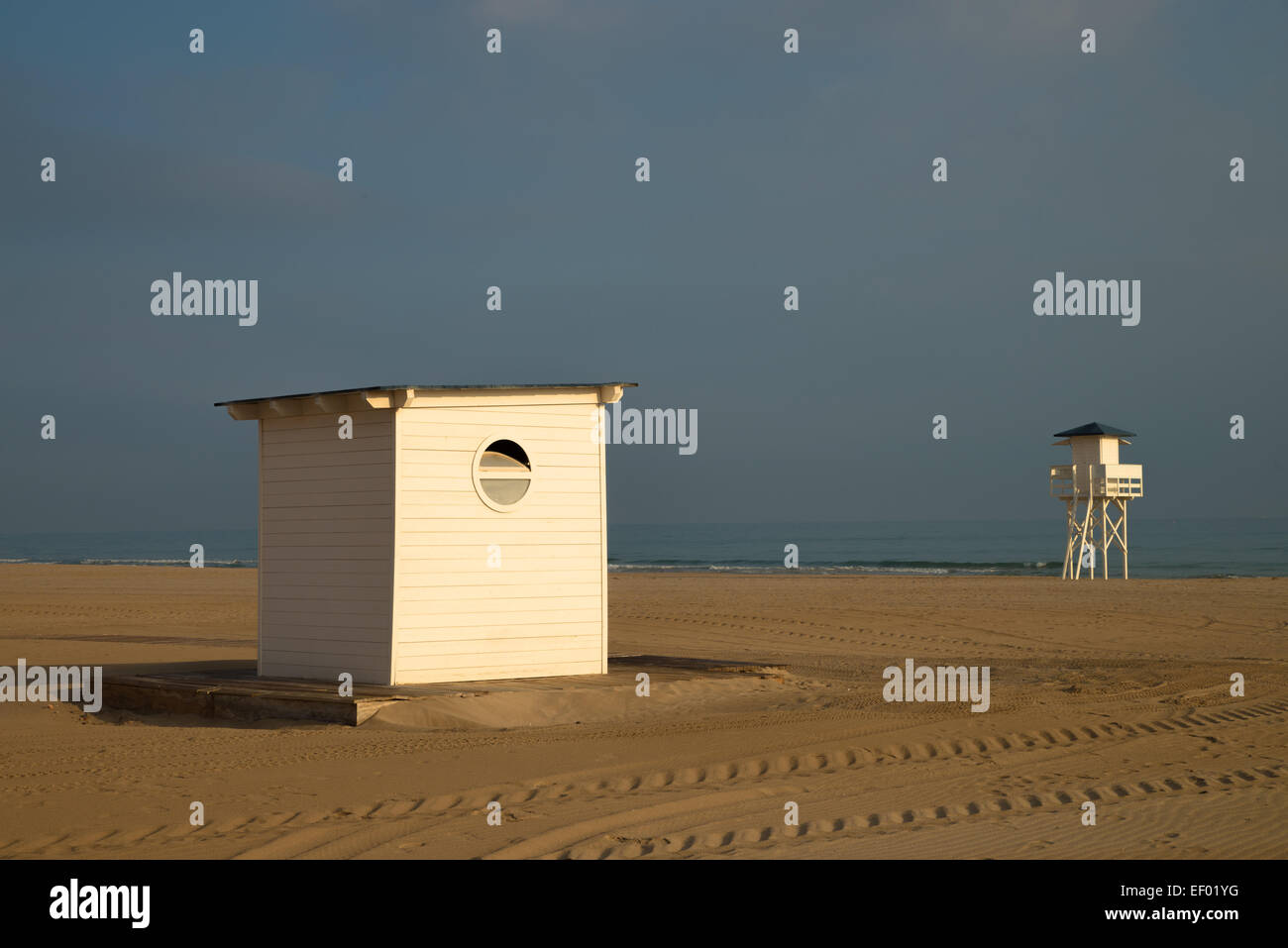 Small beach hut and lifguard tower on a sandy beach Stock Photo - Alamy