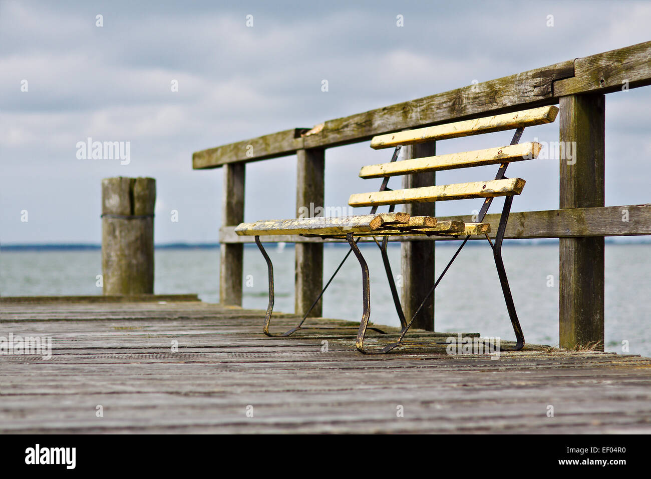 A bench on a dock Stock Photo - Alamy
