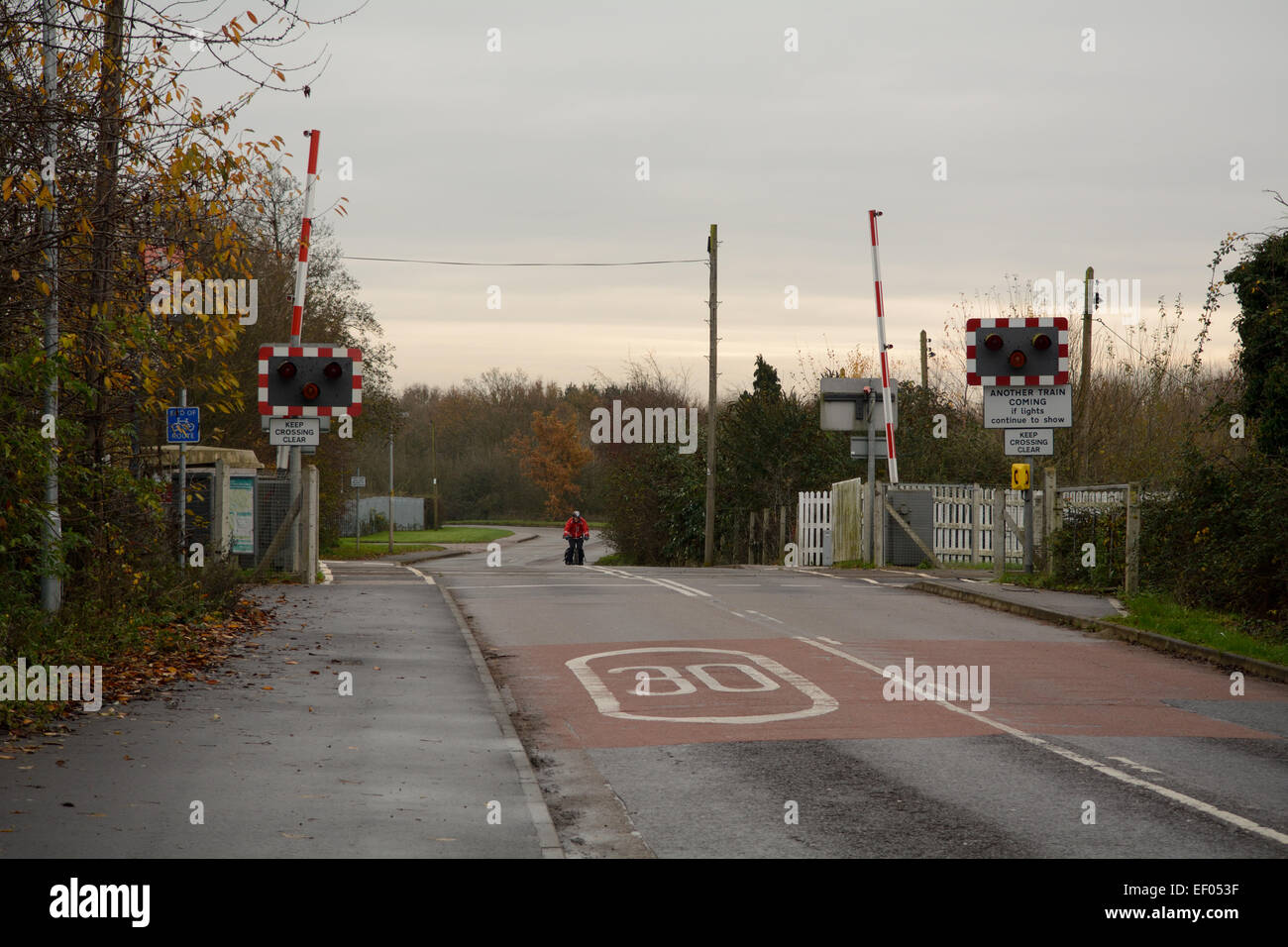 Cyclist approaching road crossing over railway line at Millbrook ...
